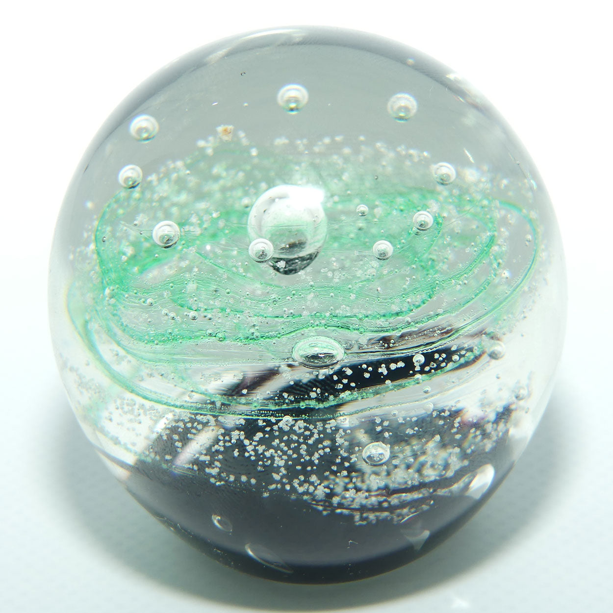 Controlled bubble within Green Swirl paperweight – Roundabout Antiques